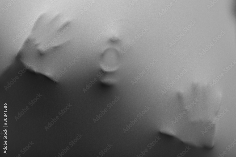 Foto de Screaming human face with hands pressing through fabric as ...