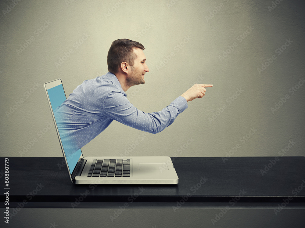 smiley handsome man got out of the laptop Stock Photo | Adobe Stock