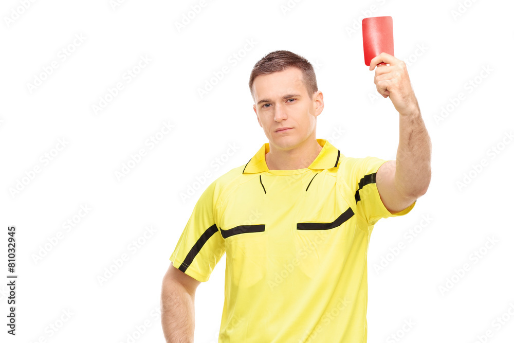 Strict football referee standing and showing a red card Stock Photo ...
