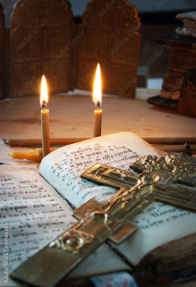 Christian still life with an old metal cross on the ancient book Stock ...