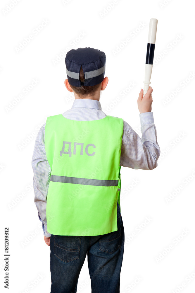 The back of young boy dressed as road policeman with staff Stock Photo ...