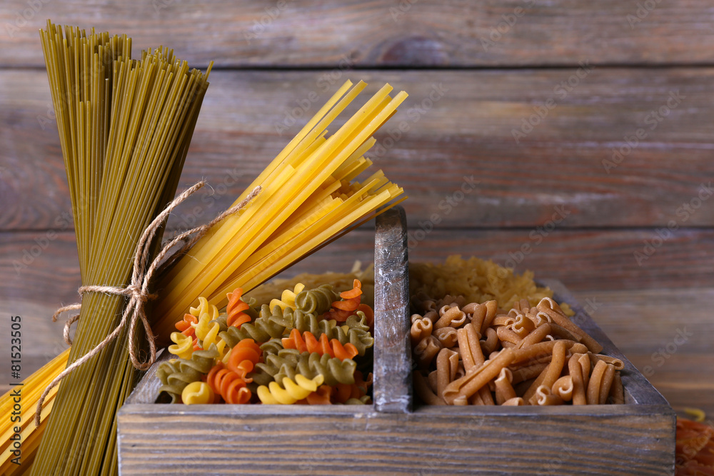 Different types of pasta in box on wooden background Stock Photo ...