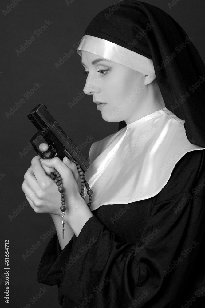 black and white portrait of woman nun holding gun Stock Photo | Adobe Stock