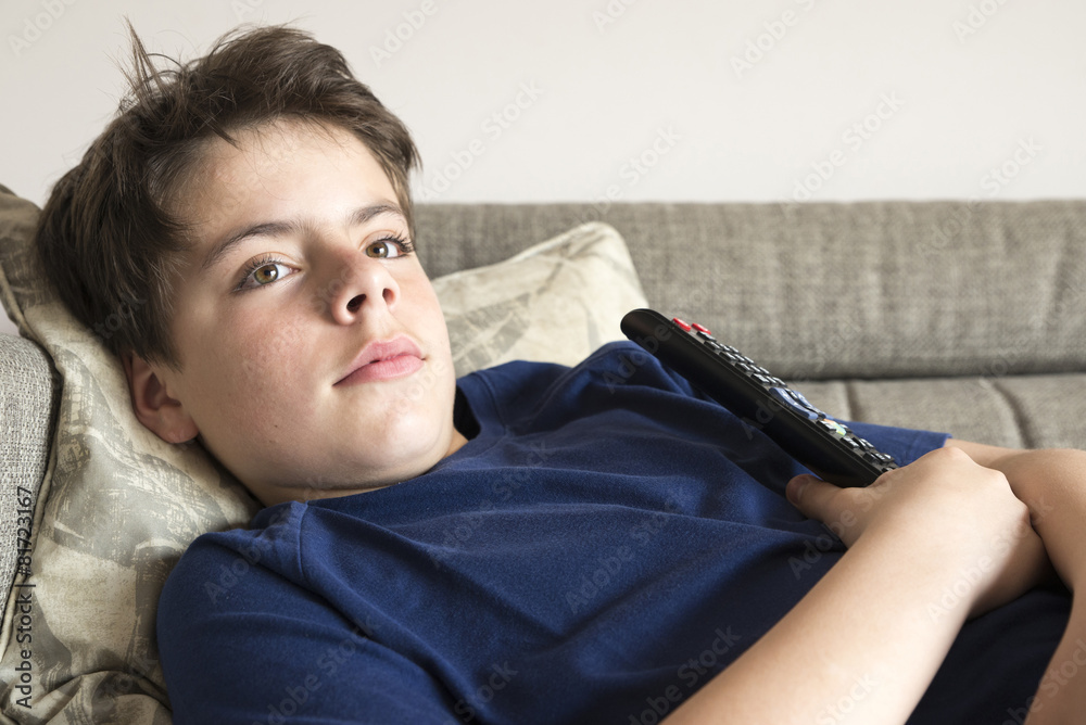 Young boy watching TV Stock Photo | Adobe Stock