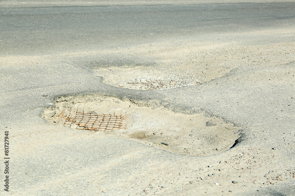 Very bad quality road with potholes foto de Stock | Adobe Stock