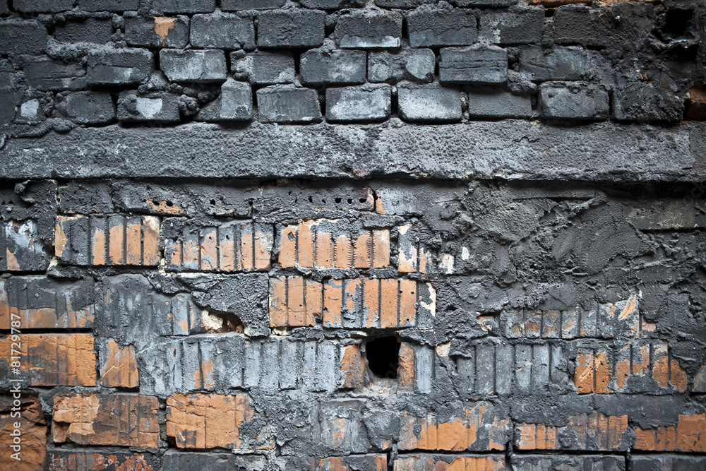Wall with old bricks and partially covered in soot Stock Photo | Adobe ...