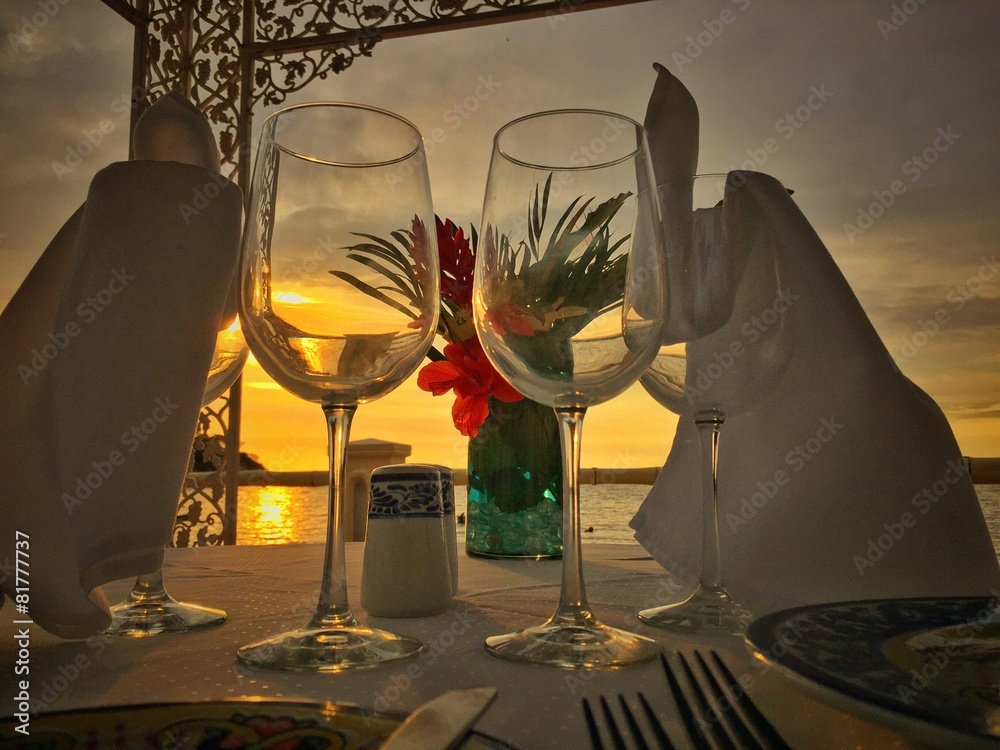 romantic dinner table setup on beach at sunset Stock Photo | Adobe Stock