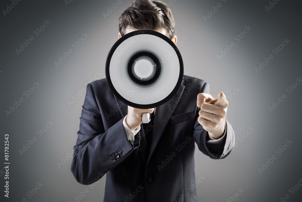 Elegant man holding a huge megaphone Stock Photo | Adobe Stock