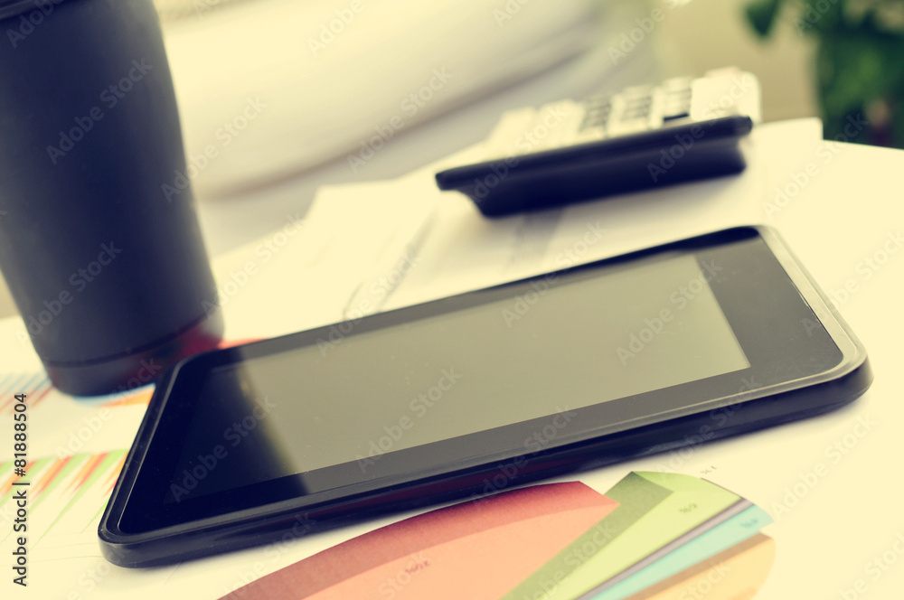 tablet and charts at the office desk Stock Photo | Adobe Stock