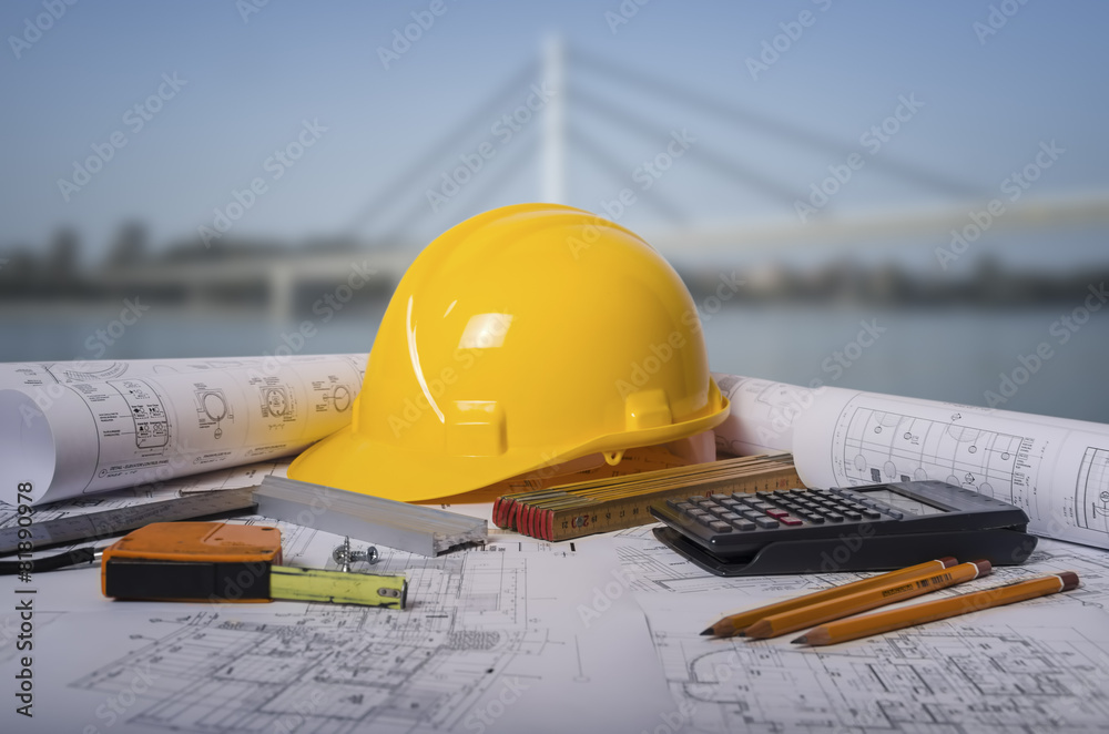 Engineer working table with safety helmet Stock Photo | Adobe Stock