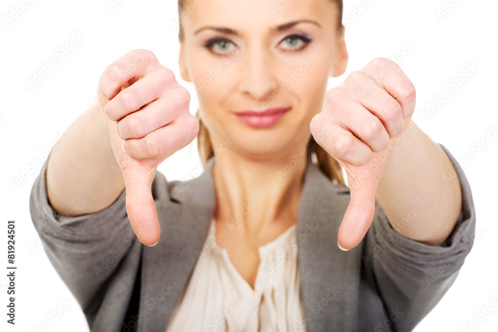 Business woman showing thumbs down. Stock Photo | Adobe Stock