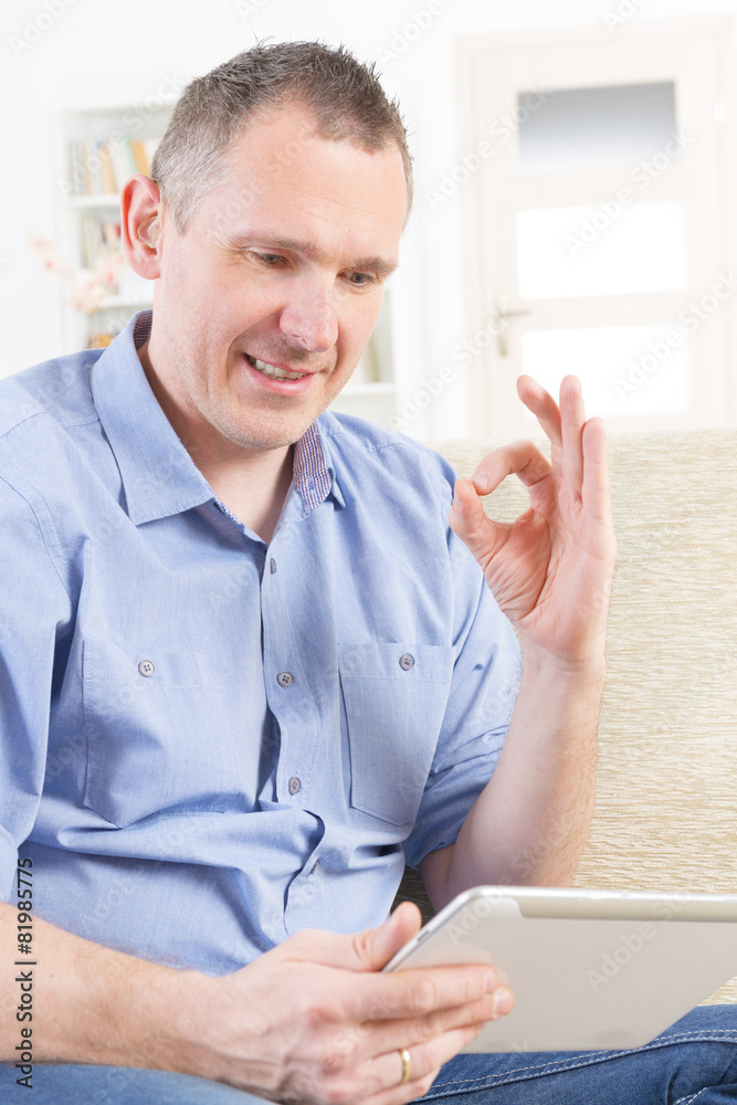 Deaf man using sign language on the tablet Stock Photo | Adobe Stock