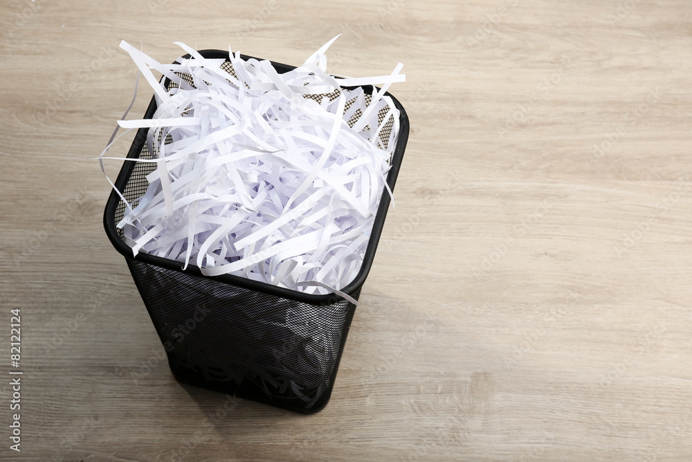 Strips of destroyed paper from shredder in trash can Stock Photo ...