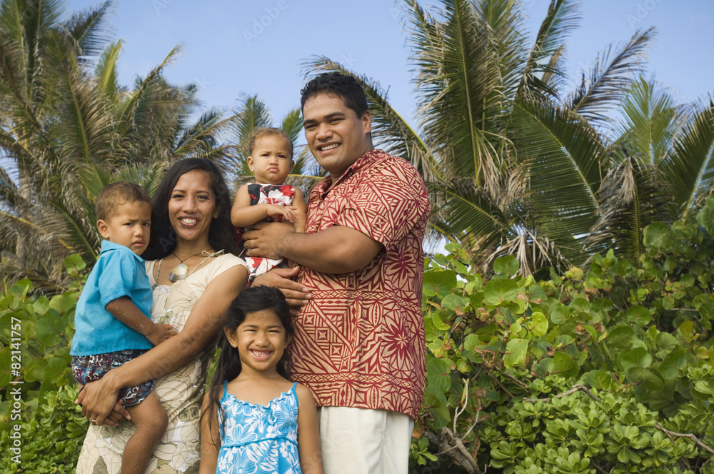 Pacific Islander family in front of palm trees Stock Photo | Adobe Stock