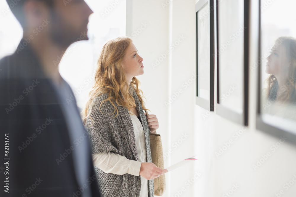 Woman admiring art in gallery Stock Photo | Adobe Stock