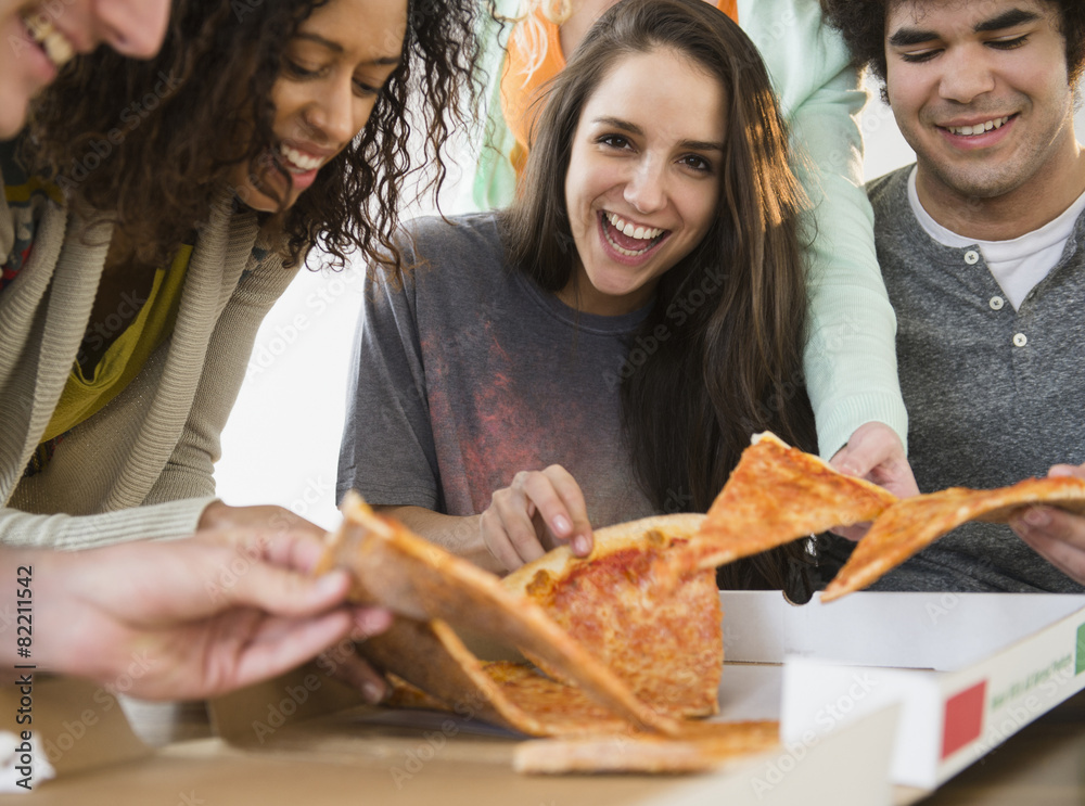 Friends having pizza together Stock-Foto | Adobe Stock