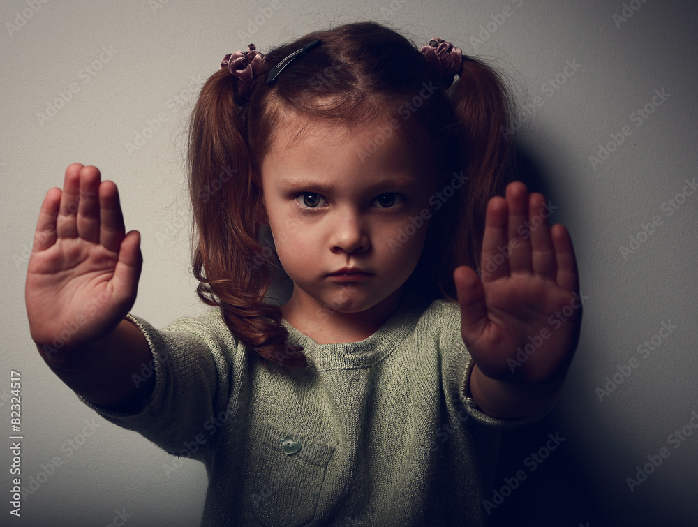 Kid girl showing two hands signaling to stop violence. Closeup p Stock ...