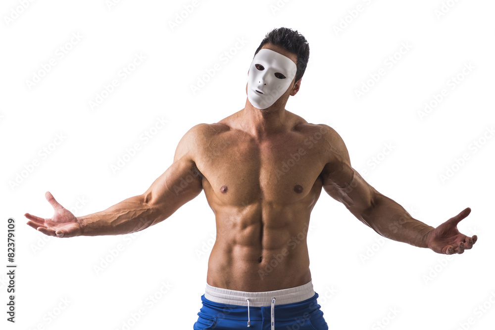Shirtless muscle man with creepy, scary mask on tilted head Stock Photo ...