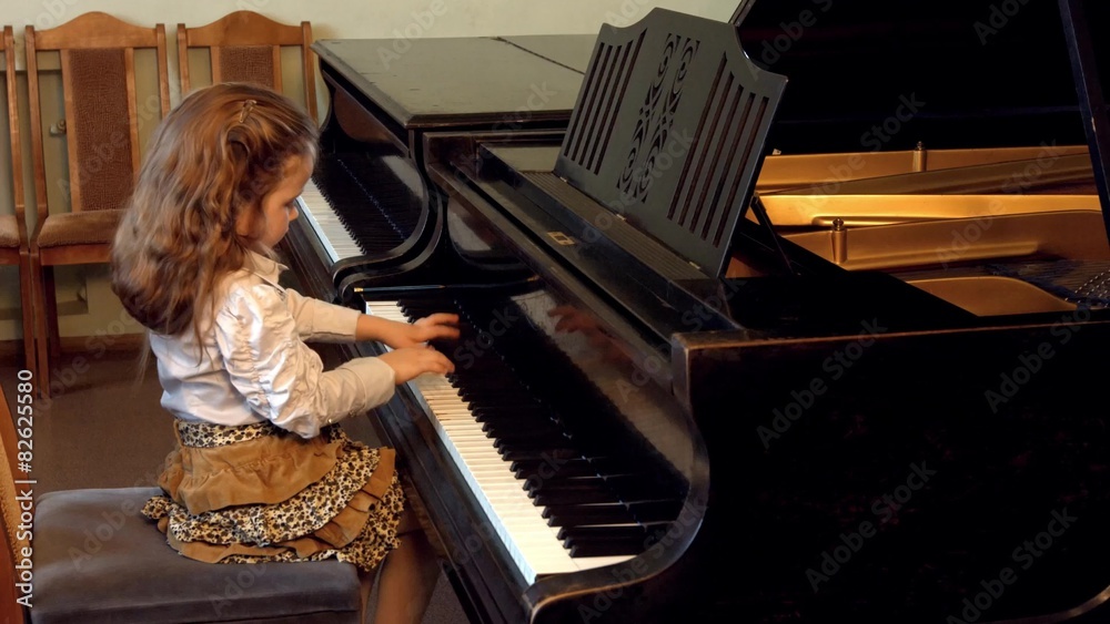 Cute little girl plaing grand piano, 4k, Dance of thes Stock Video ...