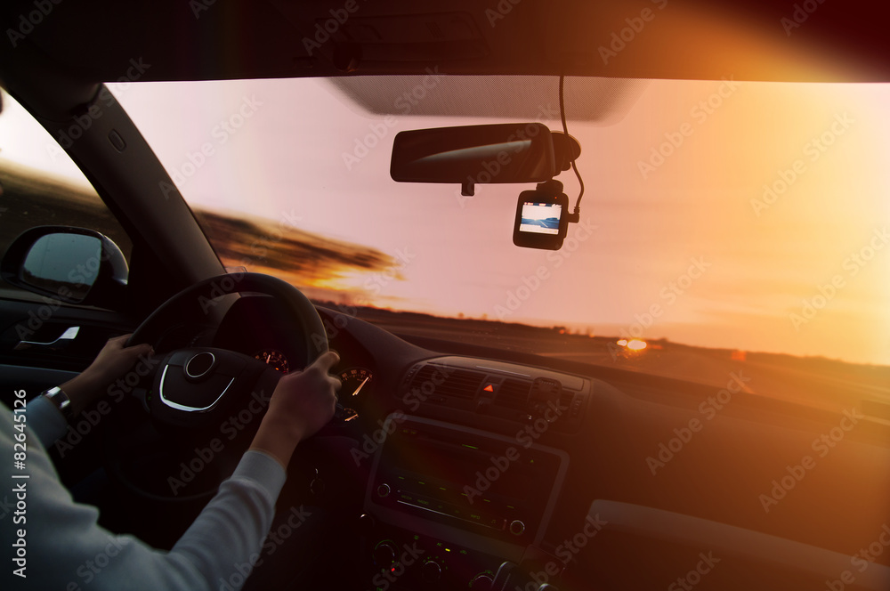 Driving at sunset with video recorder Stock Photo | Adobe Stock