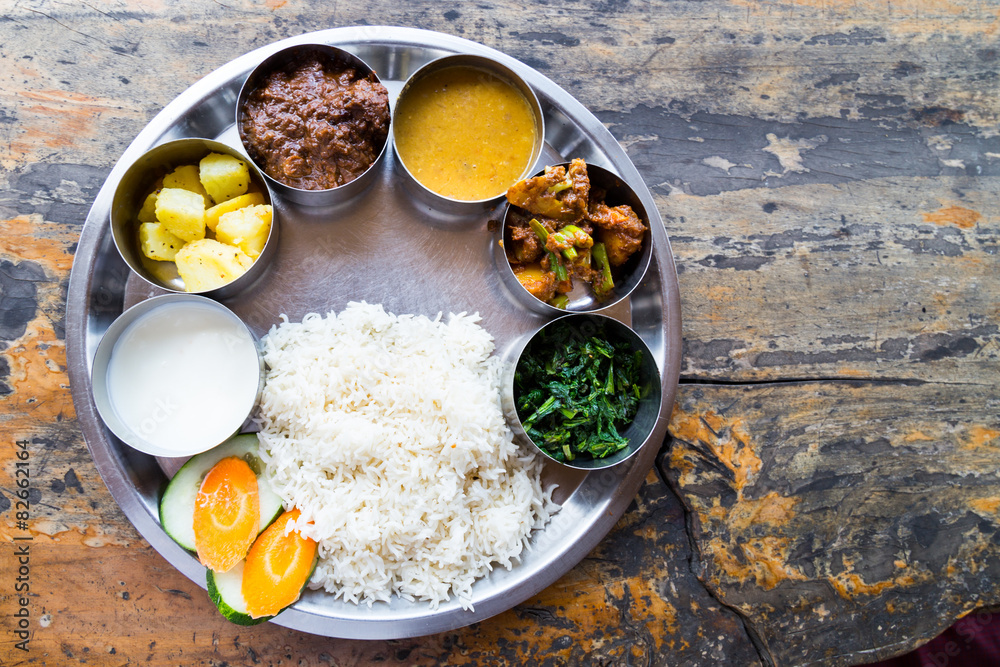 Nepali Thali meal set with mutton Photos | Adobe Stock