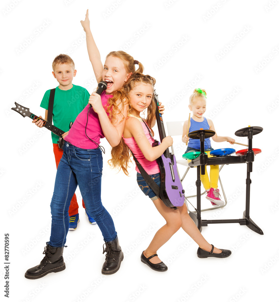 Girl singing and children playing as rock group Stock Photo | Adobe Stock