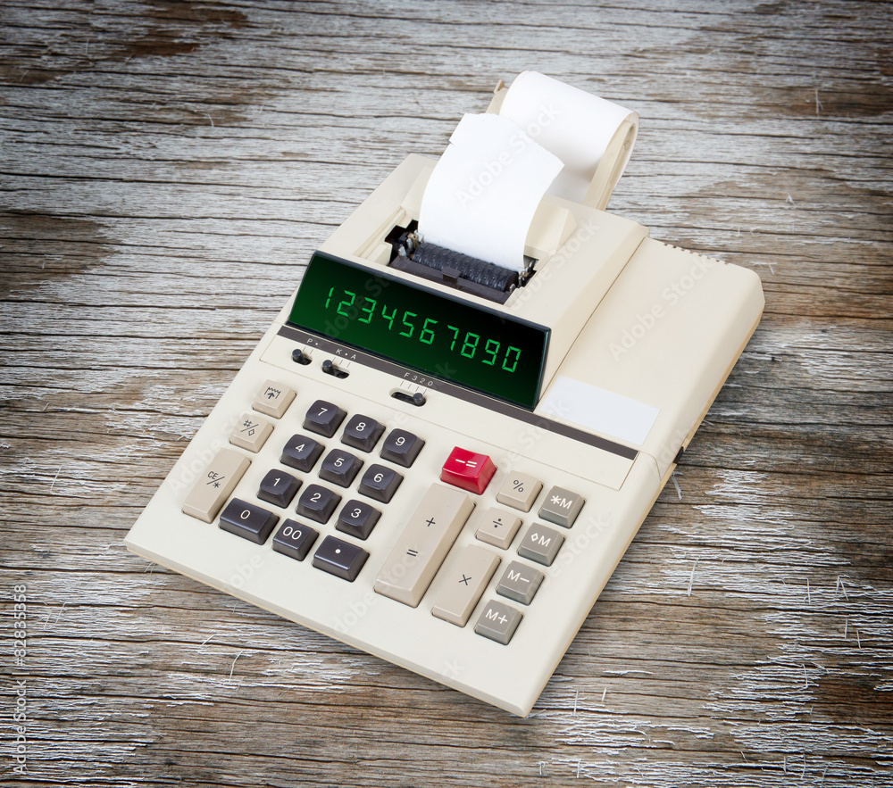 Old calculator showing a range of numbers Stock-Foto | Adobe Stock