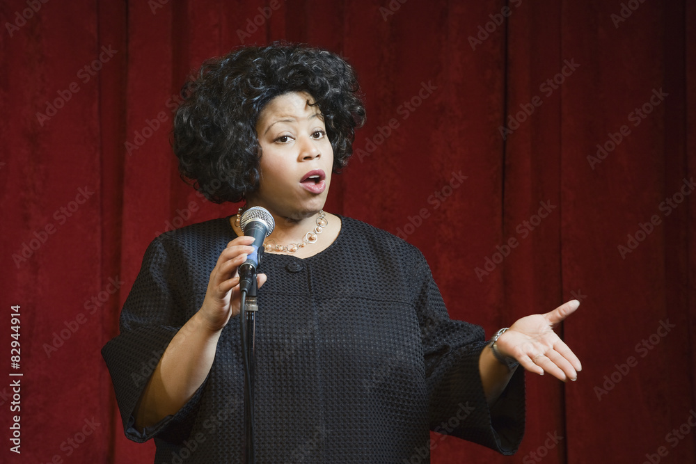 African woman singing on stage Stock Photo | Adobe Stock