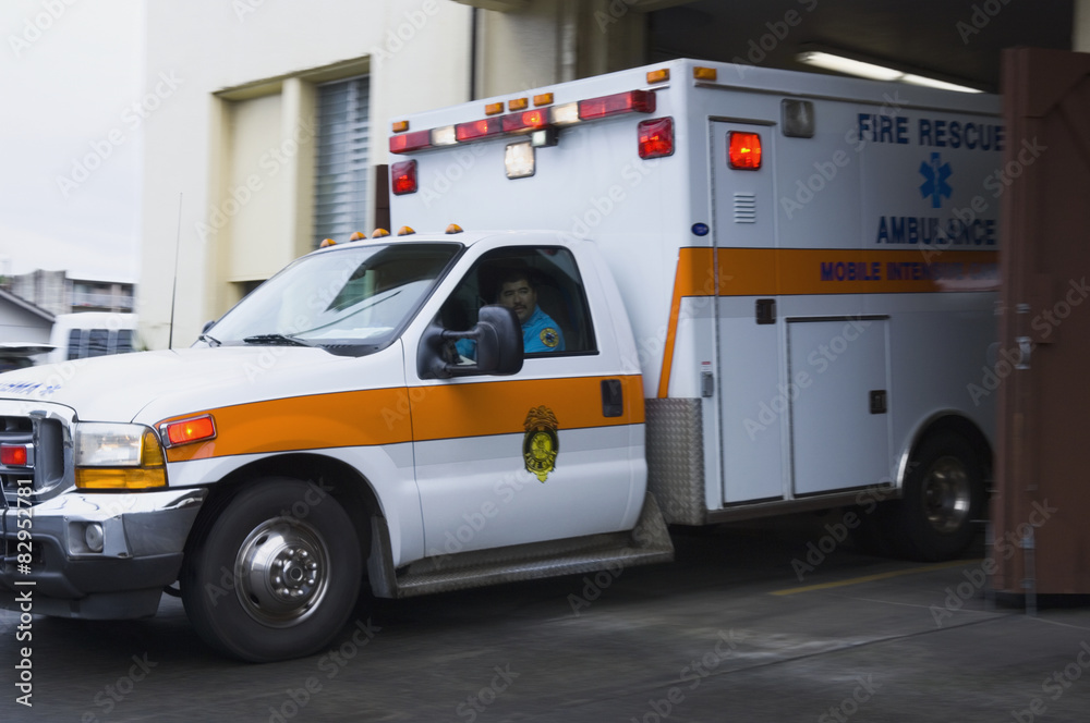 Asian male paramedic driving ambulance Stock Photo | Adobe Stock
