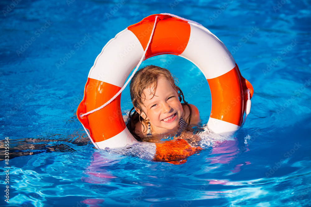 Child playing in swimming pool Stock Photo | Adobe Stock