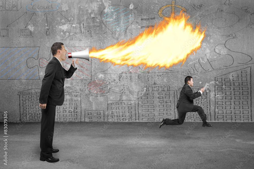 Angry boss using megaphone yelling to employee and spitting fire Stock ...