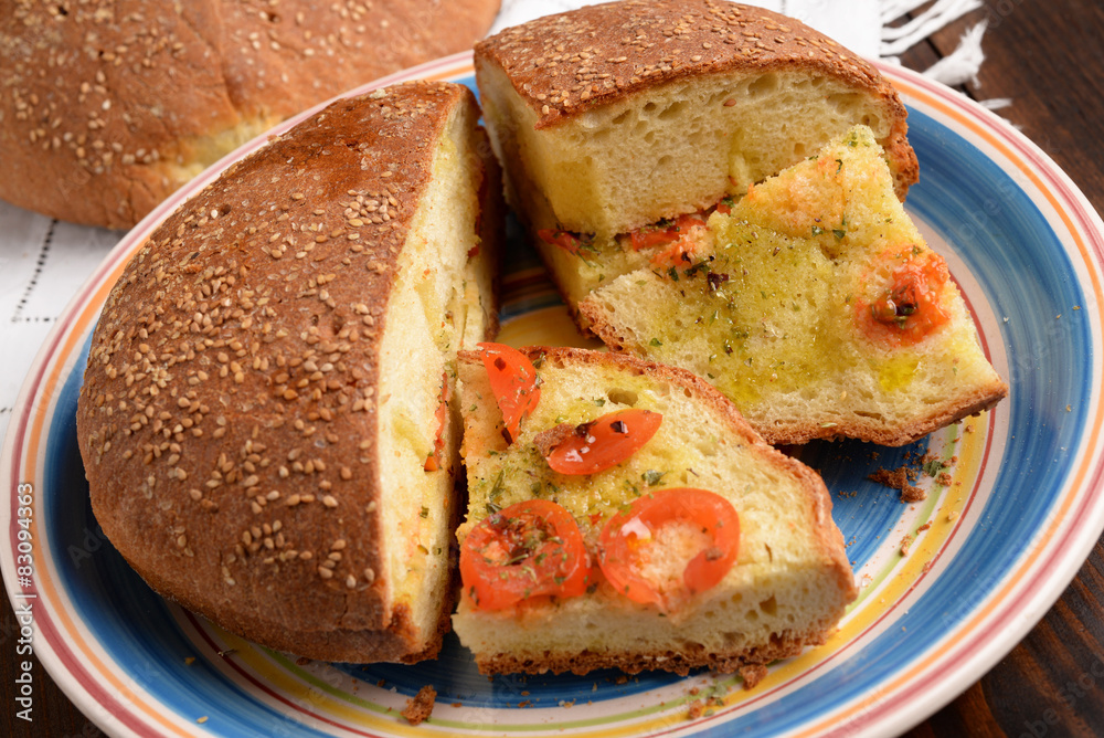 Bread baked in a wood seasoned - Pane cotto a legna condito Stock Photo ...