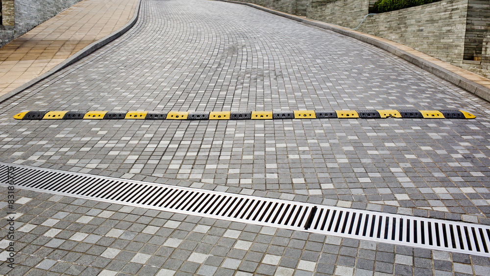 Traffic safety speed bump on an asphalt road Stock Photo | Adobe Stock