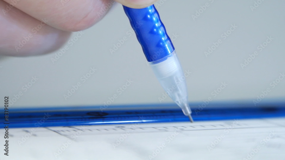 Drawing a pencil line on the ruler on the drawing sheet Stock ビデオ ...
