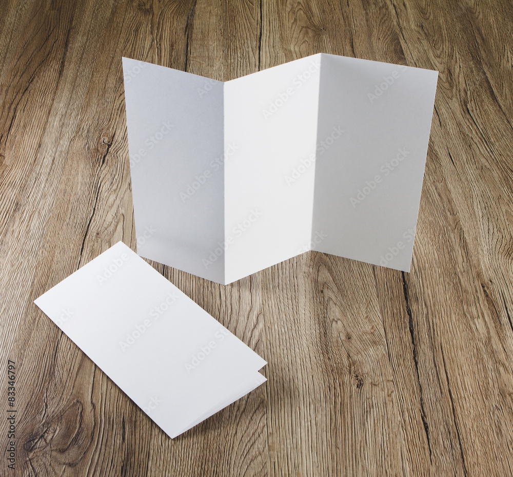 blank white folding paper flyer Stock Photo | Adobe Stock