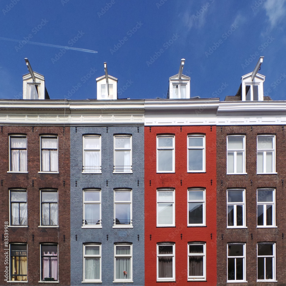 Four building facades in different colors in a row Stock Photo | Adobe ...