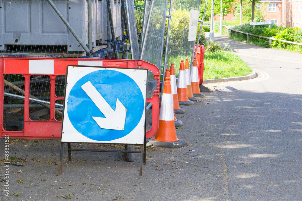 Pass in the direction shown by the arrow traffic sign closeup Stock ...