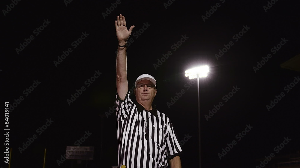A football referee makes a false start penalty hand signal Stock Video ...