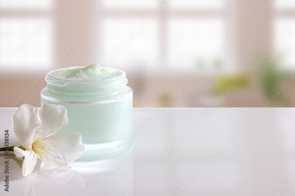 Cream jar open with flower front view windows background Stock Photo ...