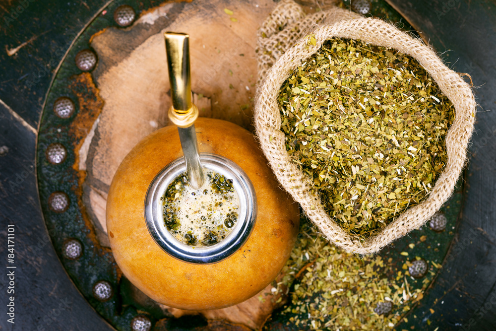 Yerba mate in a traditional gourd and bag of dry herb Stock Photo ...