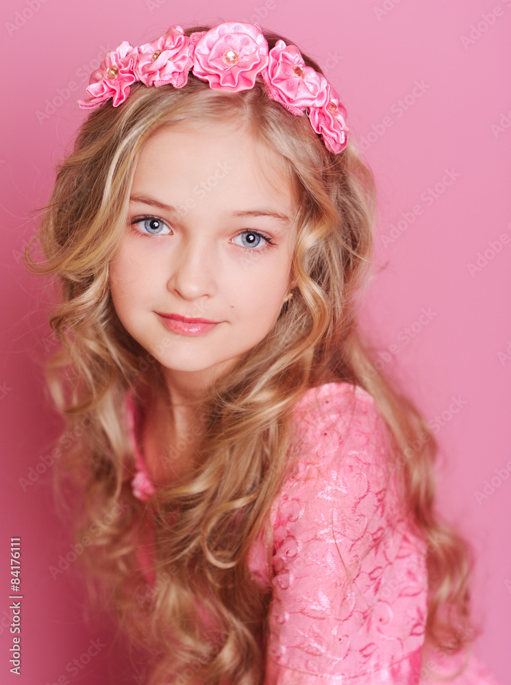 Cute kid girl 10 years old posing over pink Stock Photo | Adobe Stock