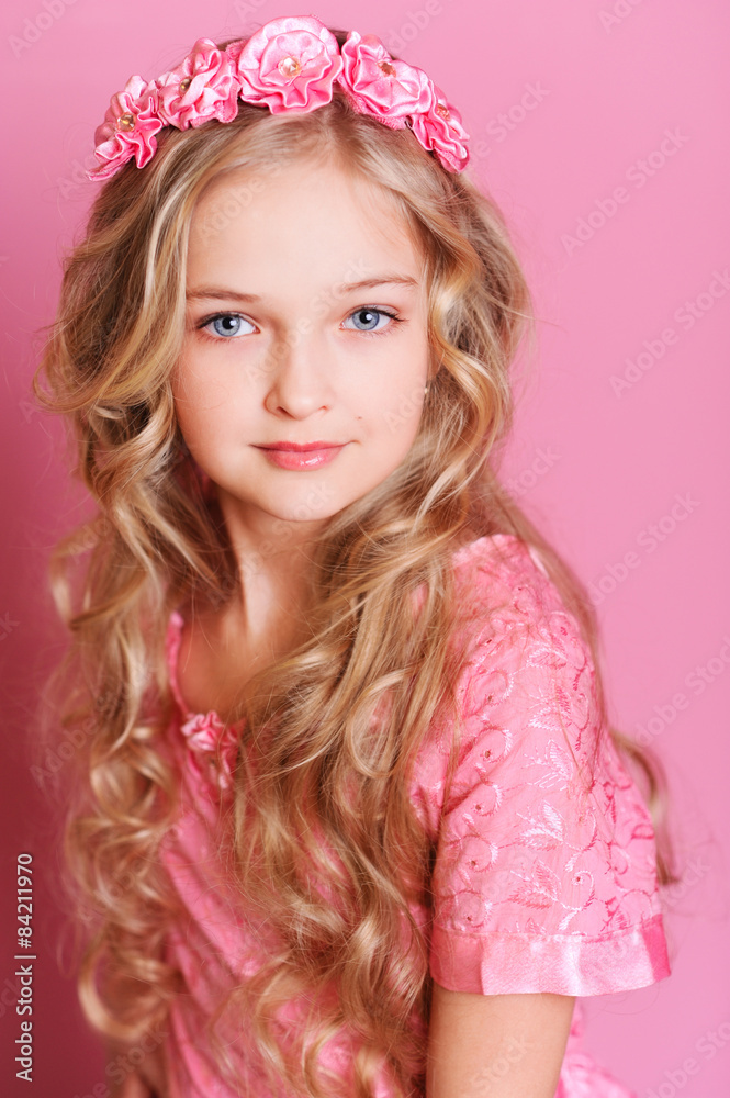 Cute kid girl 10 years old posing over pink Stock Photo | Adobe Stock
