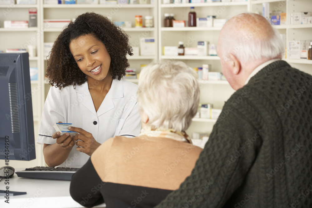 Pharmacist in pharmacy with senior couple Stock Photo | Adobe Stock