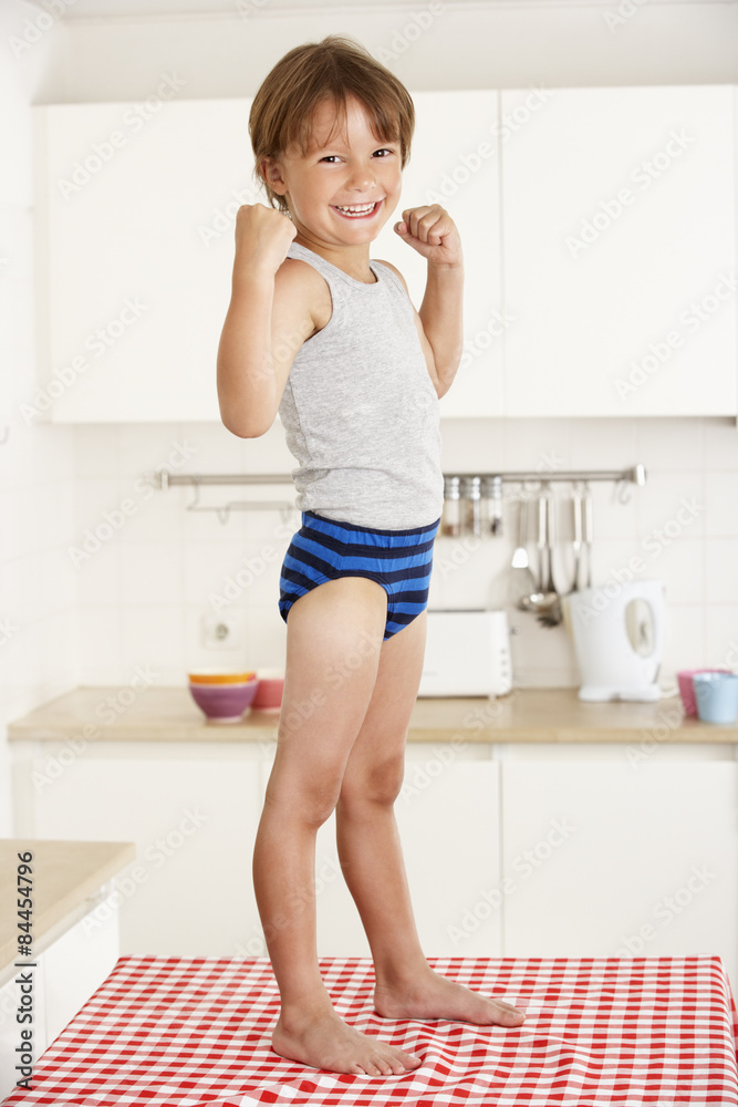 Boy Standing On Kitchen Table In Underwear foto de Stock | Adobe Stock