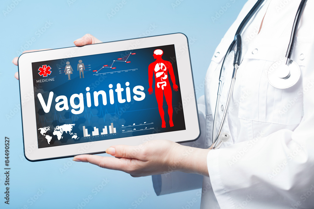 Girl holding Tablet with the diagnosis Vaginitis on the display. Stock ...