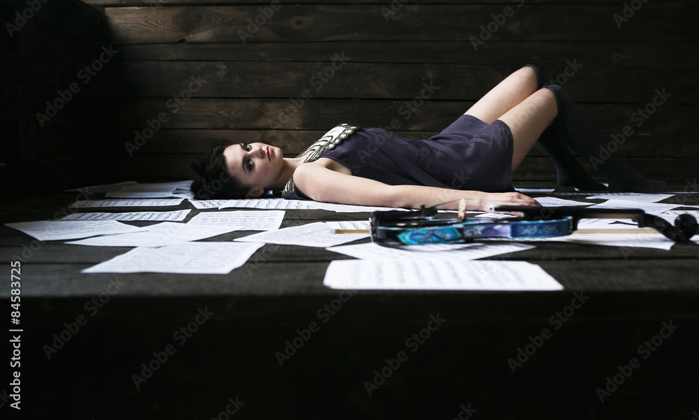 girl posing in a dark room on the floor Stock Photo | Adobe Stock