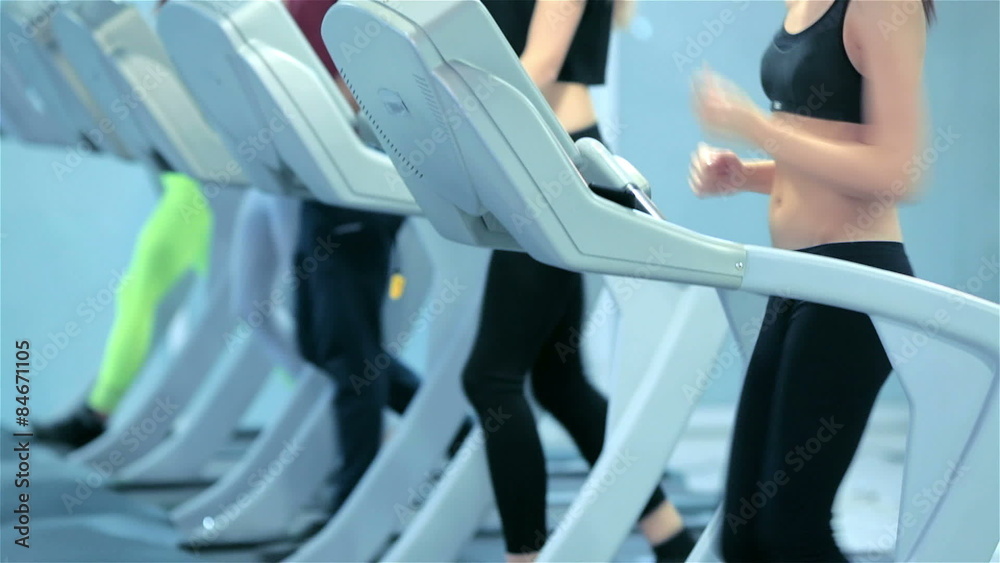 Fitness running people. Sports people running on the treadmill at the ...