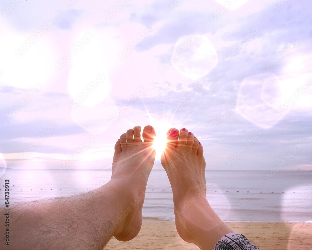 sun between couple feet. Photos | Adobe Stock