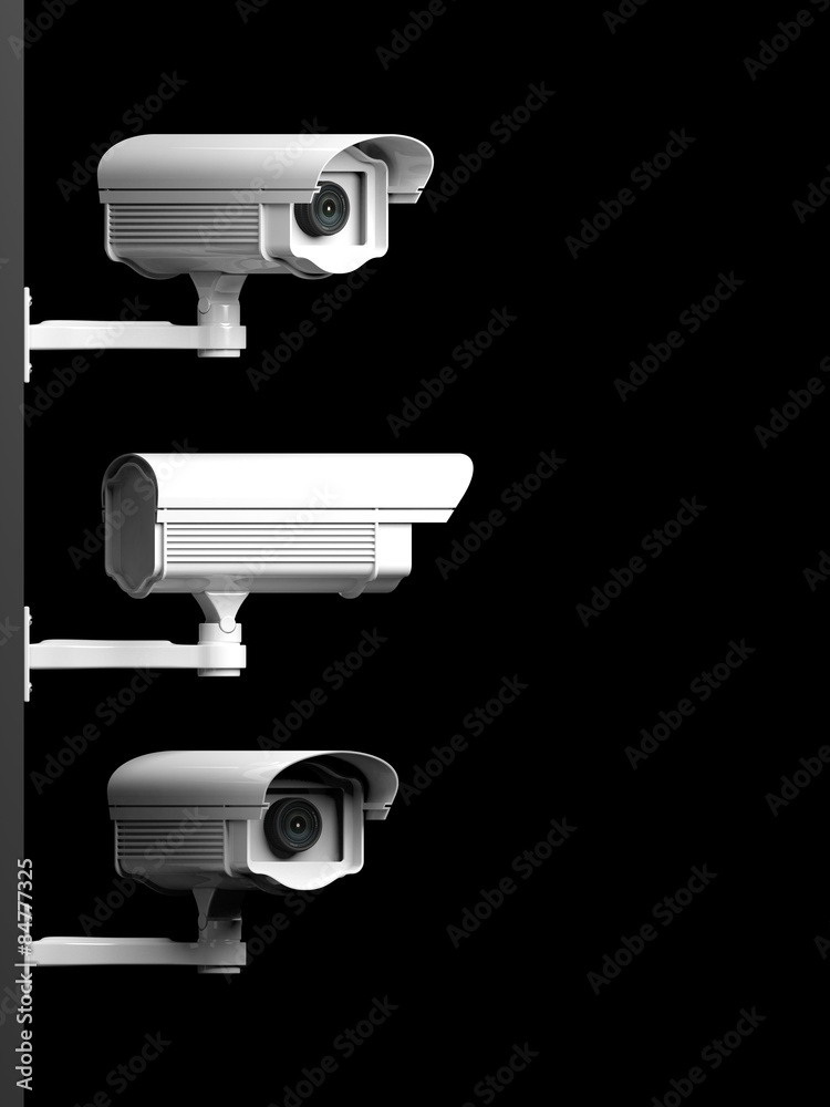 Three security surveillance cameras side view isolated on black ...