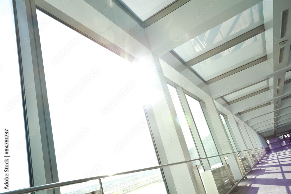Sunny on modern glass office windows building interior corridor Stock ...